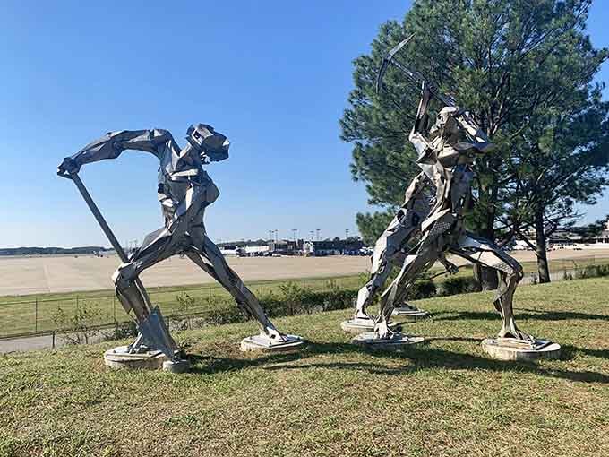 These metal sculptures look like they're having a conversation about modern art while posing for tourist photos.