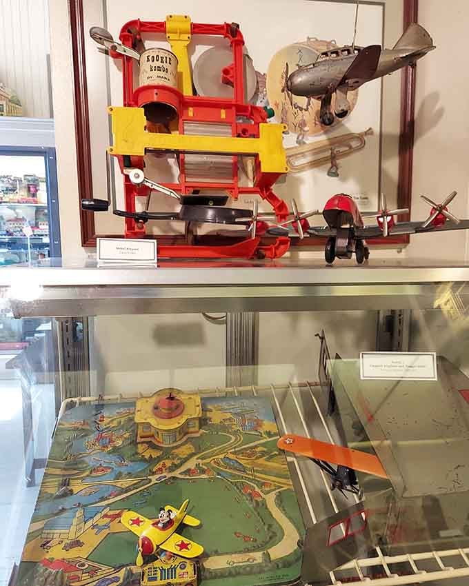 Vintage tin airplanes and colorful playsets remind us that kids once conquered the skies without a single battery required.