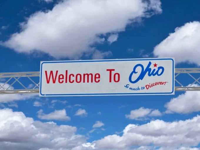 Blue skies and Ohio pride go hand in hand, especially when that welcome banner stretches across the highway like a hug.