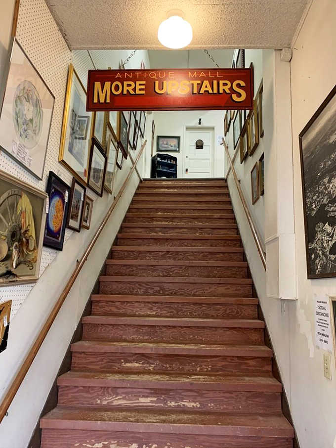 That vintage sign isn't lying: climbing these stairs reveals an entirely new world of collectible temptations above.
