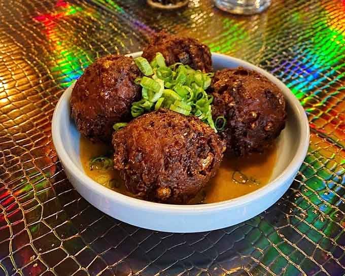 Golden corn fritters swimming in savory broth prove that vegetables can be just as indulgent as any comfort food.