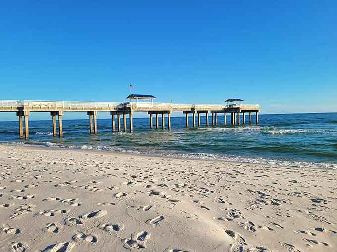 The fishing pier stretches into those turquoise waters like an invitation you can't refuse, and honestly, why would you?