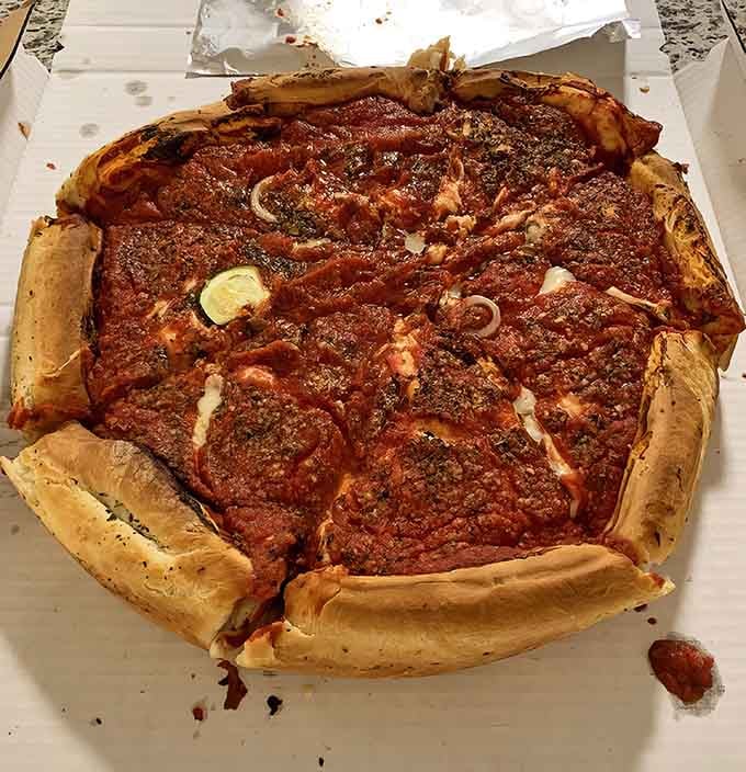 This stuffed deep-dish stands taller than your average pizza's ambitions, with layers that defy gravity and good sense.
