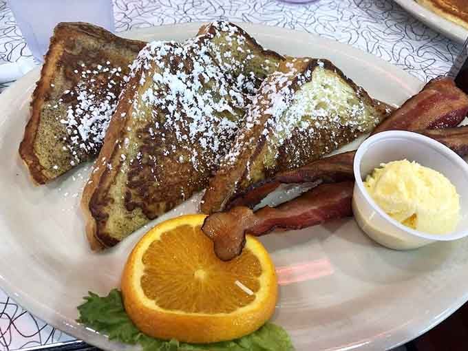 French toast dusted with powdered sugar and served with bacon proves some mornings are worth waking up for.