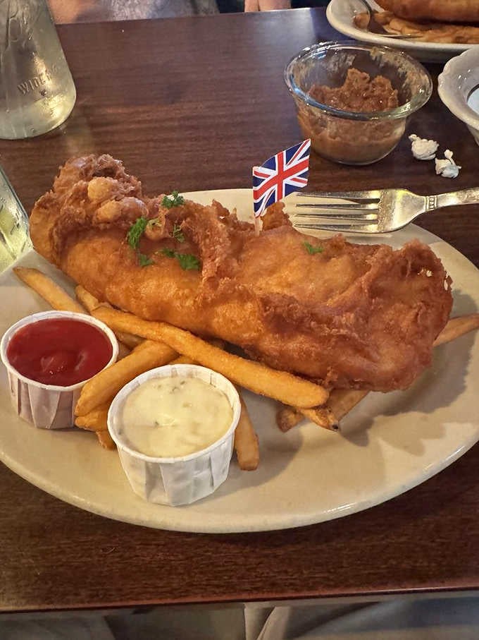 That golden-fried fish with the Union Jack proudly planted on top means serious business about authenticity.