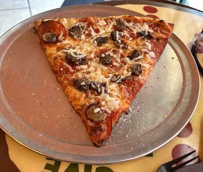 This single pepperoni slice could double as a personal flotation device in an emergency, just saying.