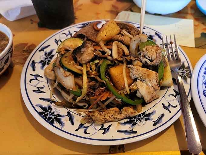 Your custom Mongolian grill creation arrives perfectly cooked, a testament to your ingredient-selection skills and their grilling expertise.