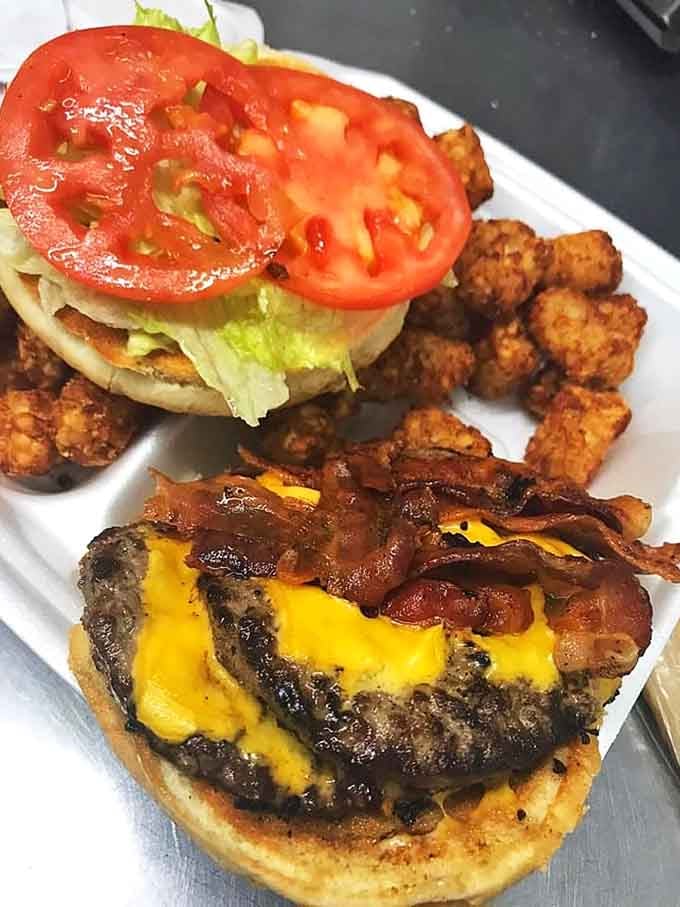 This isn't just a cheeseburger, it's a full-contact sport requiring strategy, determination, and possibly a bib.