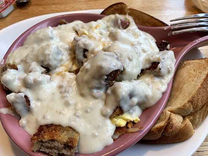 That chicken fried steak buried under country gravy is the breakfast equivalent of a warm hug from someone who really means it.