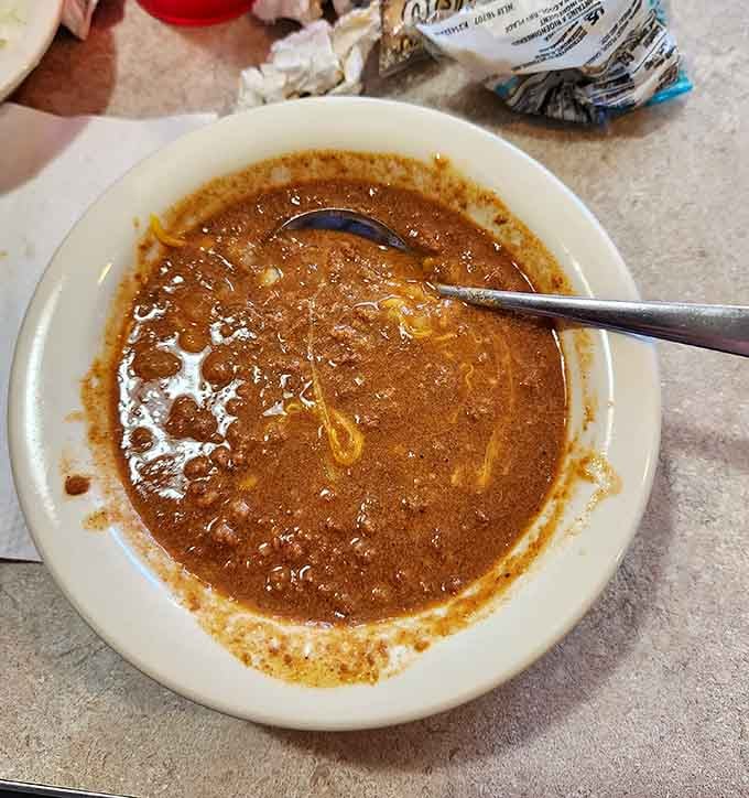 A bowl of Cincinnati chili in its purest form, that mysterious spiced sauce ready to convert skeptics into believers.