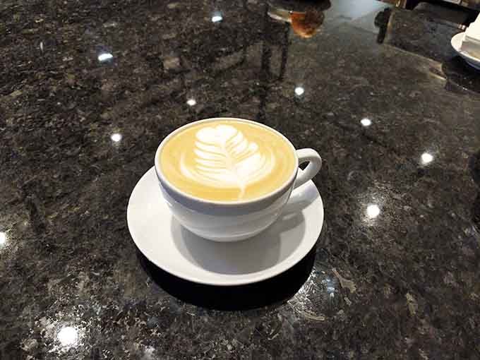 That latte art is almost too pretty to drink, but let's be honest, you're drinking it anyway.