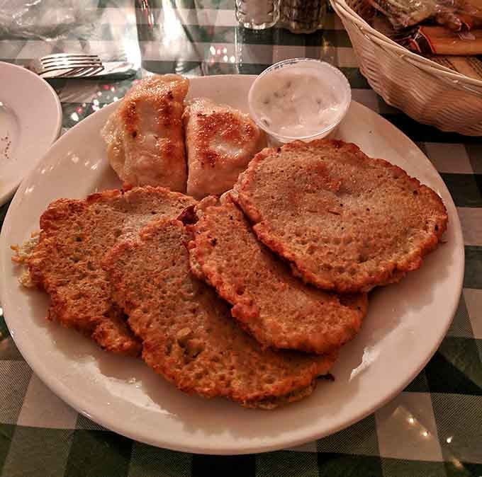 Golden potato pancakes arrive like edible frisbees of joy, crispy outside and tender within perfection.