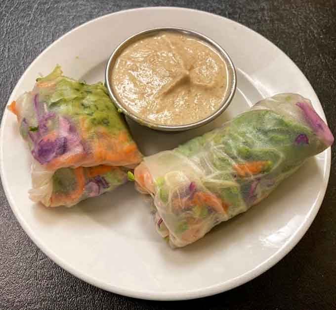 Fresh spring rolls so colorful they belong in an art gallery, served with peanut sauce that deserves its own fan club.