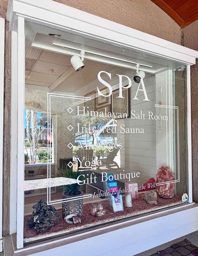 That window display isn't shy about what's on offer &ndash; halotherapy, infrared sauna, massages, and yoga all under one roof.