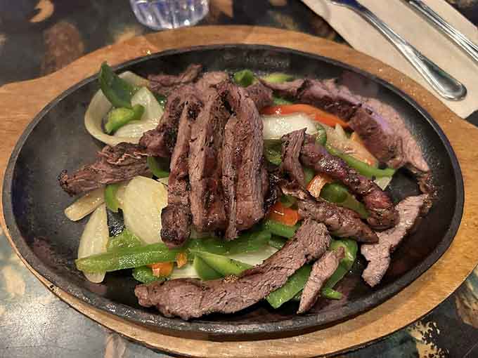 Sizzling fajitas that arrive with more drama than a telenovela and taste even better than they look.