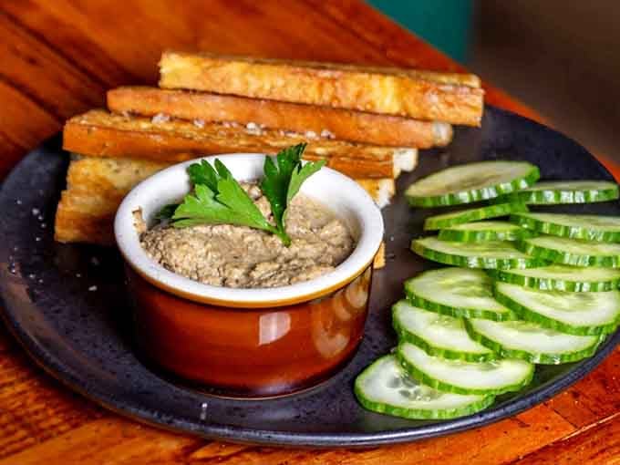 Mushroom pate served with the kind of presentation that makes you feel sophisticated just looking at it.