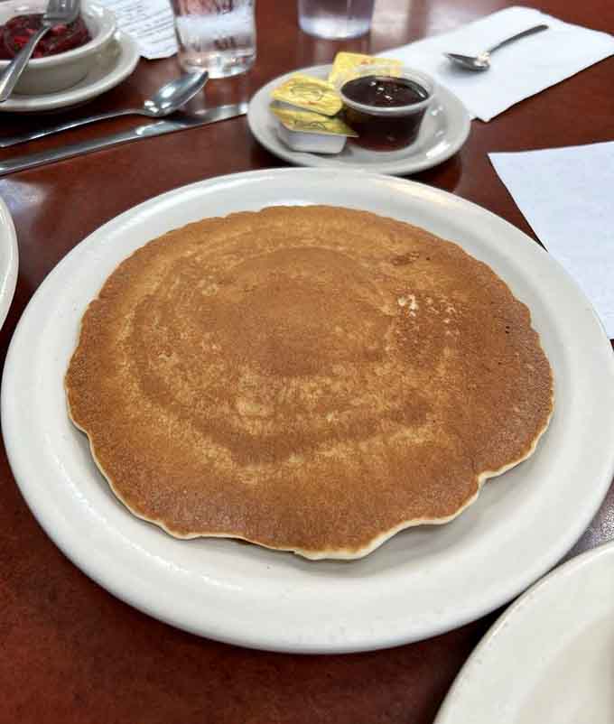 This pancake could double as a dinner plate, proving that bigger really is better when breakfast is involved.