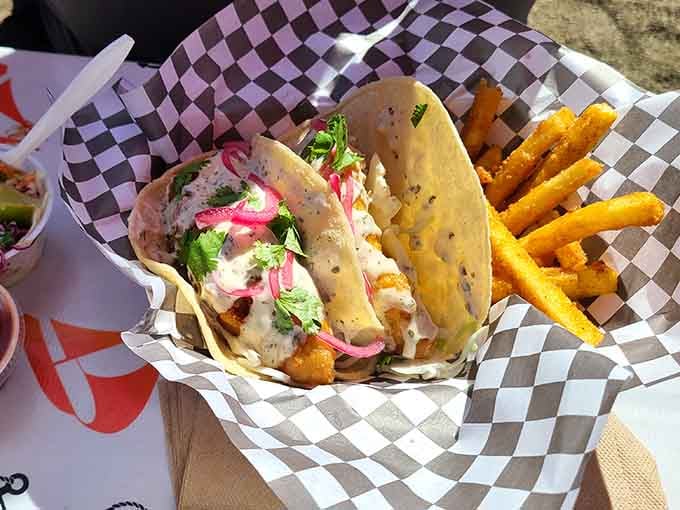 Fish tacos dressed up with all the right toppings, proving tortillas make everything better, even on the coast.