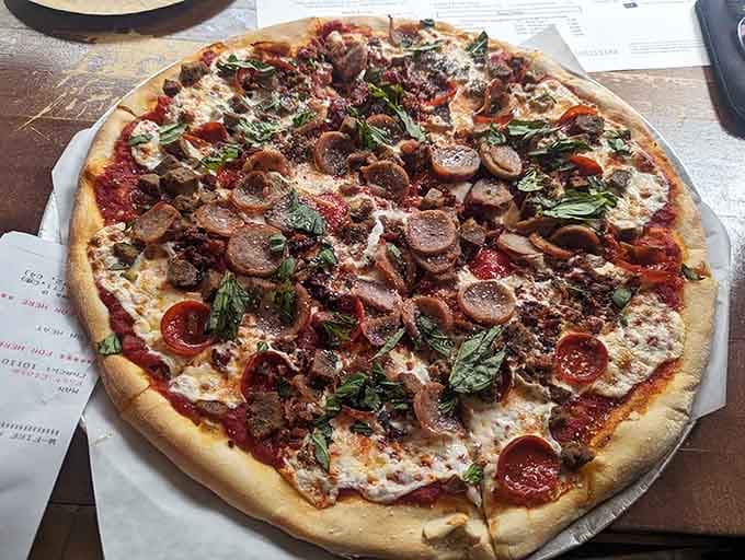 Loaded with toppings that would make your cardiologist nervous and your taste buds ecstatic, this is pizza.