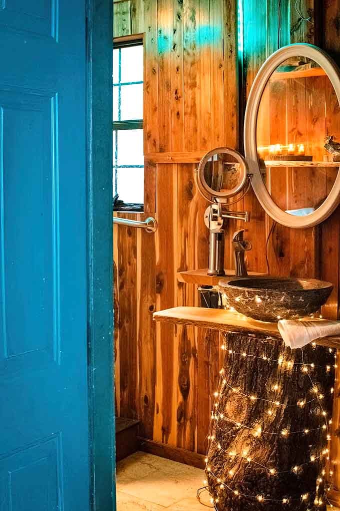 Even the bathroom gets the rustic-chic treatment, because why should indoor plumbing be boring?