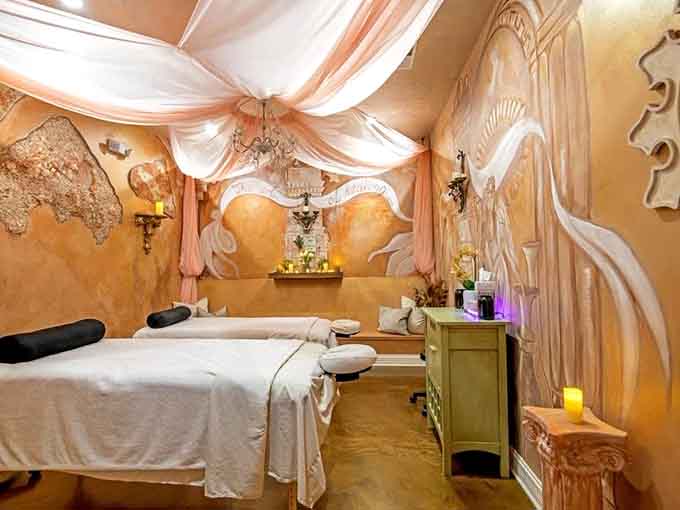 Draped fabrics and ornate details make this Royal Salt Cave & Spa massage room feel like royalty's personal relaxation chamber.