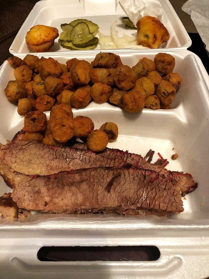 Look at that smoke ring on the brisket, paired with golden hush puppies that could make a vegetarian reconsider everything.