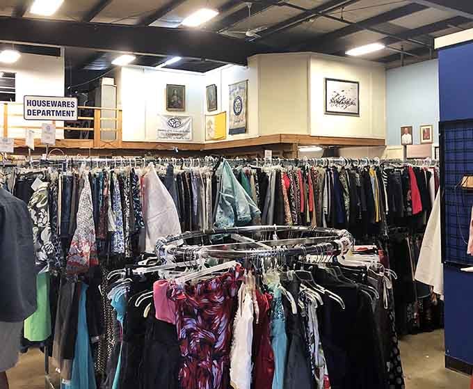 Women's clothing organized by color creates a rainbow effect that makes shopping feel less like work, more like art.