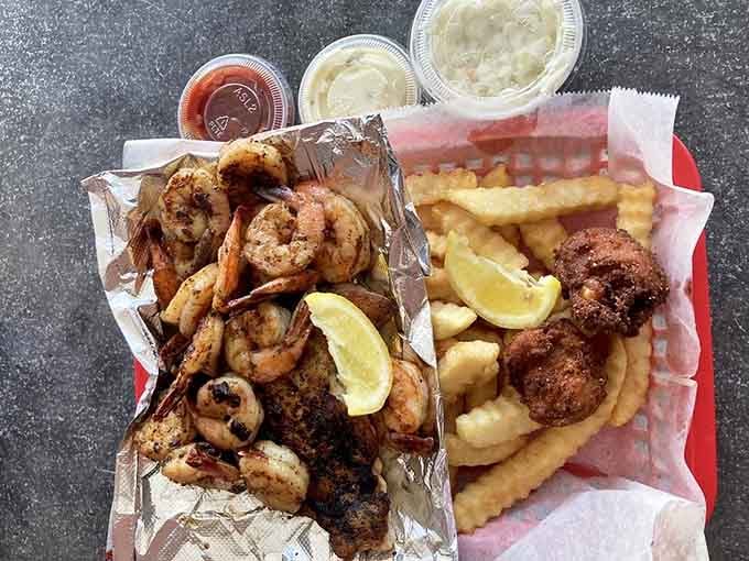 Blackened shrimp and fries proving that sometimes the simplest presentations let the quality ingredients do all the talking here.