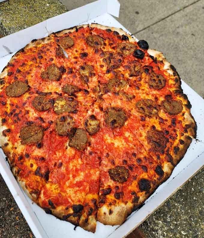 Those char marks aren't accidents, they're the delicious fingerprints of a coal-fired oven doing its magic.