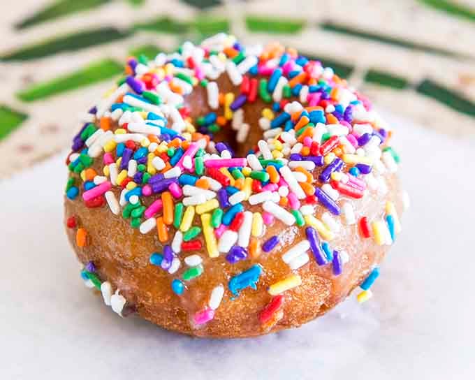 Rainbow sprinkles piled so high they're defying gravity and possibly several laws of physics too.