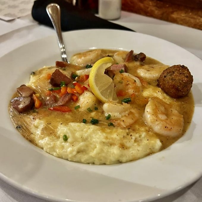 Shrimp and grits done right, with plump shrimp swimming in sauce over creamy stone-ground grits that'll ruin you.