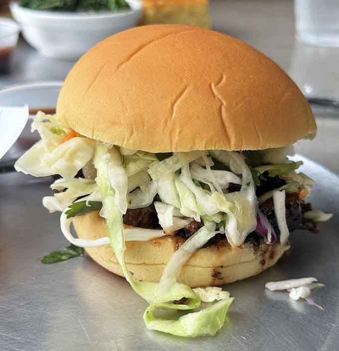 That sandwich wears its coleslaw crown like barbecue royalty, simple and utterly satisfying in every bite.