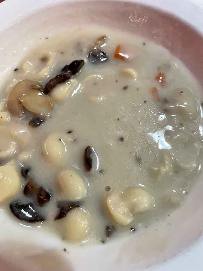 Creamy mushroom soup with tender chunks floating throughout, warming you from the inside like a culinary hug.