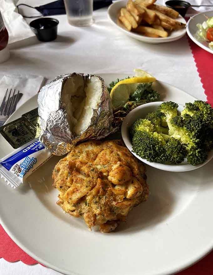 When your crab cake needs a supporting cast, baked potato and broccoli show up ready to work.
