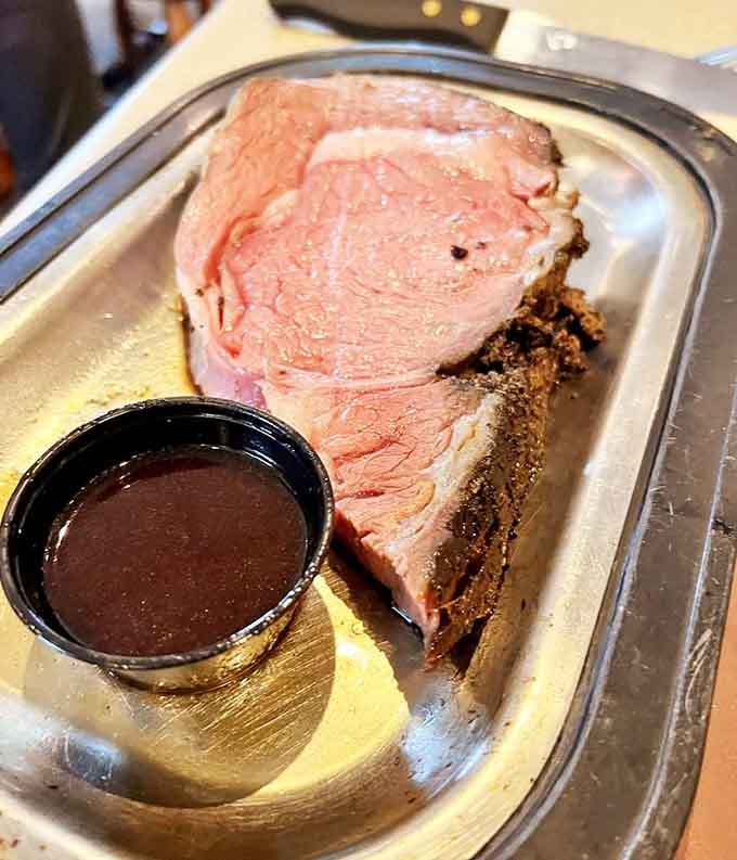 Prime rib sliced thick and served with au jus, proving that some traditions never go out of style.
