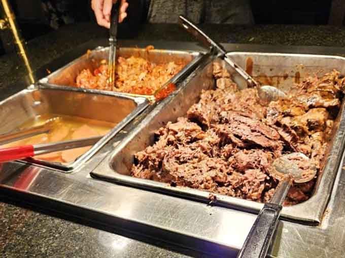 That brisket looks tender enough to cut with a stern glance, smoky perfection piled high and proud.