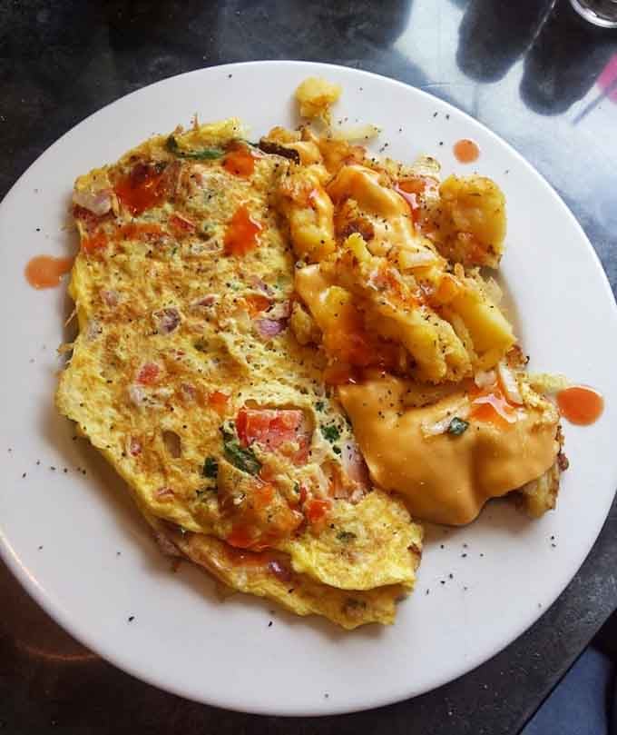 This Western omelet proves that everything's bigger in diners, stuffed with enough ingredients to fuel your entire day ahead.