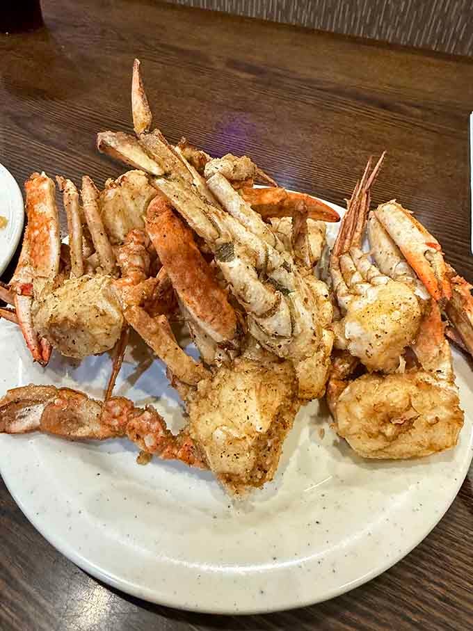 Snow crab legs piled high like treasure from the sea, ready for you to crack into sweet, succulent perfection.