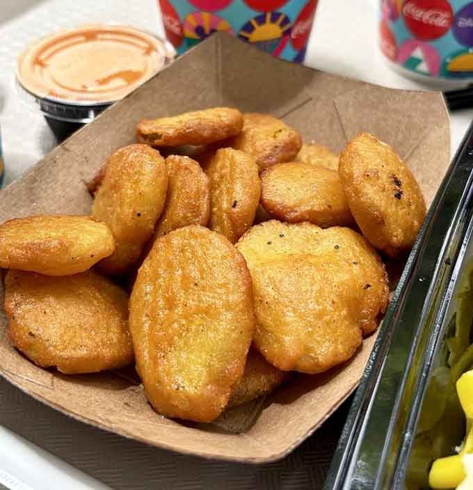 Golden fried pickles that would make your grandmother simultaneously proud and slightly scandalized about the calories.