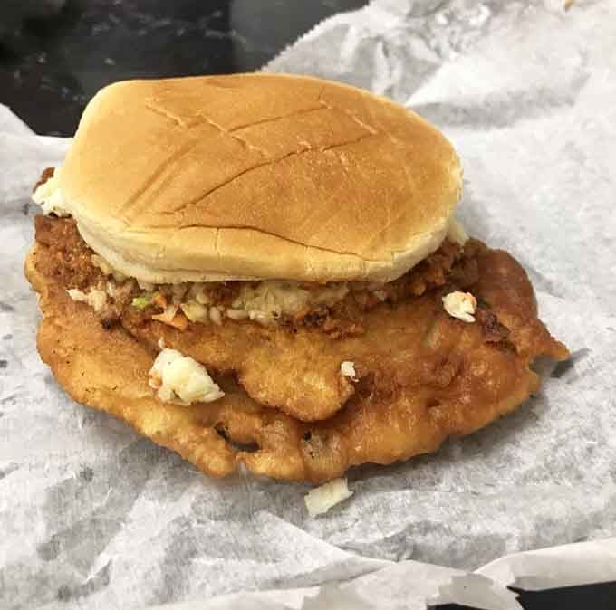 The legendary pork chop sandwich looks deceptively simple until that first glorious, messy, unforgettable bite happens.