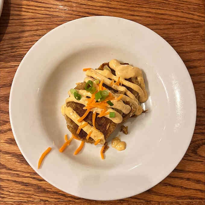 Crab cakes this beautifully plated prove that comfort food can still have serious style and sophistication.