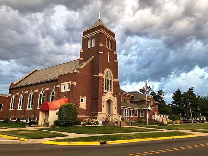 Dramatic skies over historic brick create the kind of architectural moment that makes you slow down and appreciate craftsmanship.