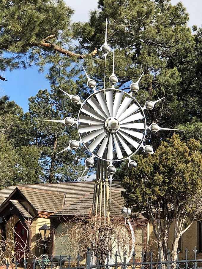 The Spirit of the Sun radiates outward like a cosmic flower, its spherical ornaments dancing on delicate arms of steel.