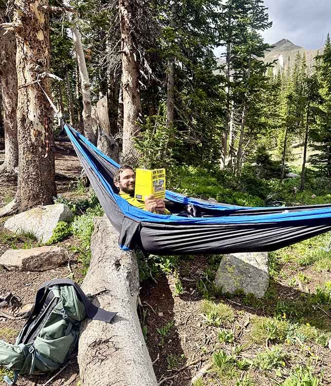 Reading in a hammock with mountain views beats scrolling through your phone by approximately a million percent.