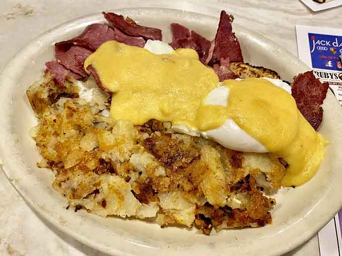 Golden hollandaise cascading over perfectly poached eggs and crispy hash browns &ndash; breakfast doesn't get more satisfying than this classic combination.