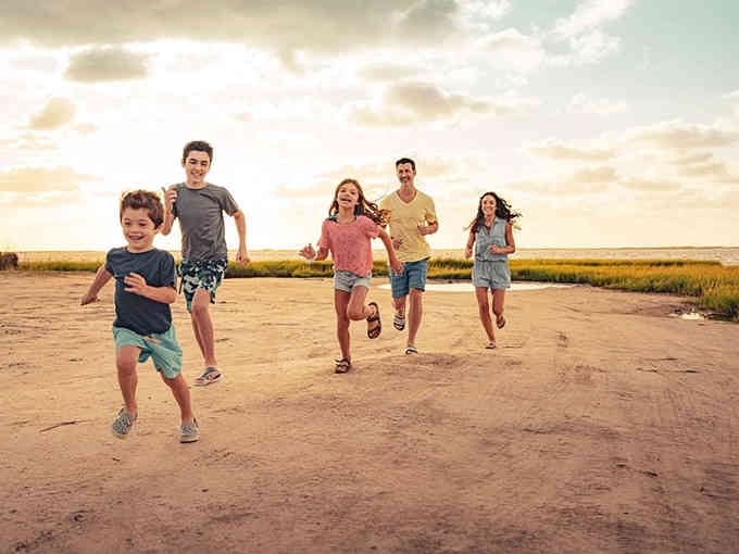 Running toward adventure like you're in a commercial for happiness, which is basically what vacation should feel like.