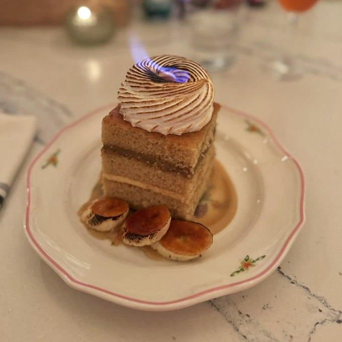 That torched meringue topping on banana cake looks like something from a fancy patisserie, not an all-you-can-eat buffet.