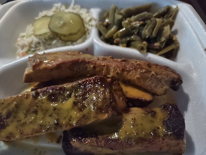 Ribs so tender they practically wave goodbye to the bone, glistening with that perfect smoke-kissed sheen of barbecue perfection.