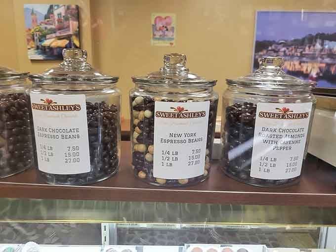 Glass jars lined up like soldiers guarding treasures: espresso beans and almonds dressed in dark chocolate armor.