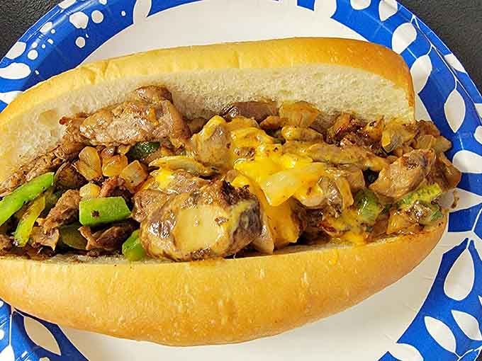 This cheesesteak situation on a hoagie roll is the kind of lunch that makes afternoon meetings feel worthwhile.